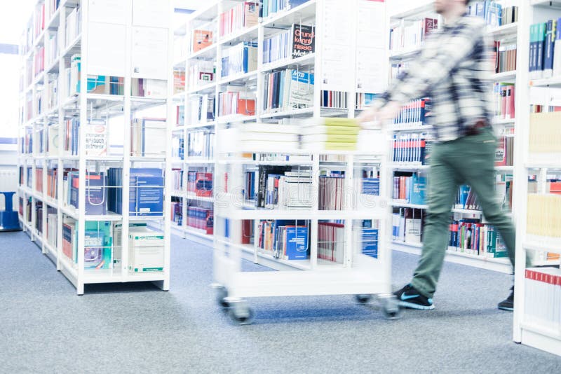 Books at a University Library Editorial Photo - Image of shelving ...