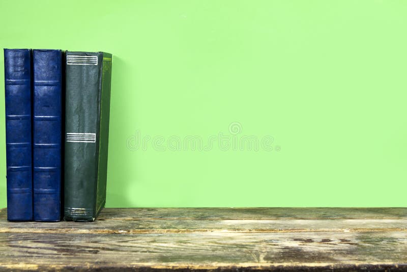 Books on Wood Table with Blank Wall for Artwork Display Stock Image ...