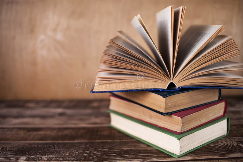 Books on the wooden table stock image. Image of colored - 90519275
