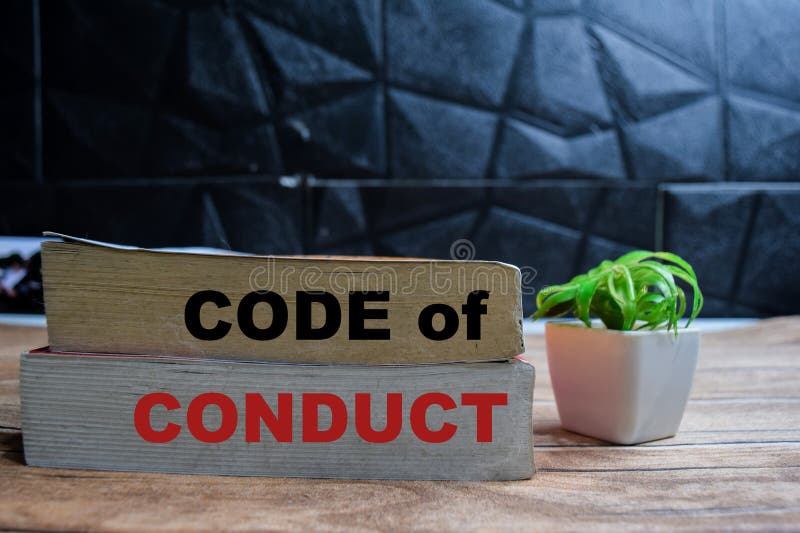 Books with Words Code of Conduct on Wooden Table and Black Background ...