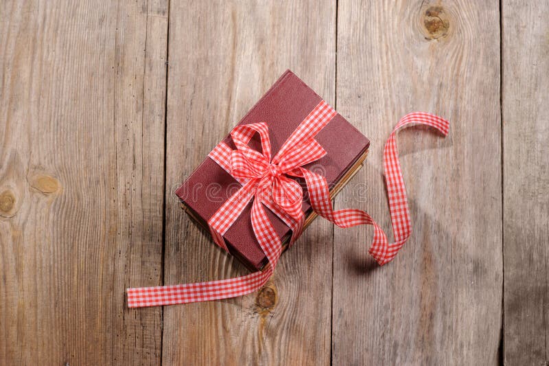 Books Wrapped with Color Ribbon, on Wooden Table Stock Photo - Image of ...