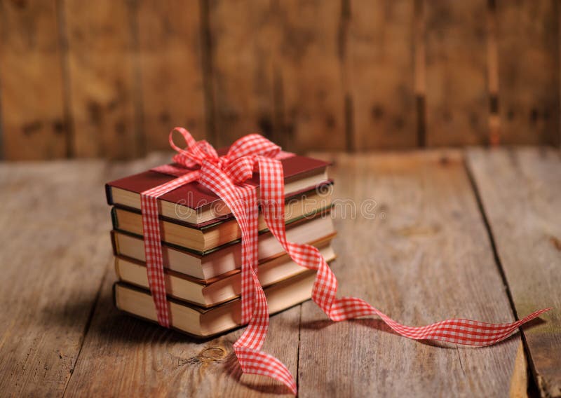 Books Wrapped with Color Ribbon, on Wooden Table Stock Image - Image of ...