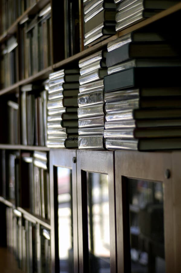 Bookshelves Piled with Books Vertical Stock Image - Image of bookstore ...