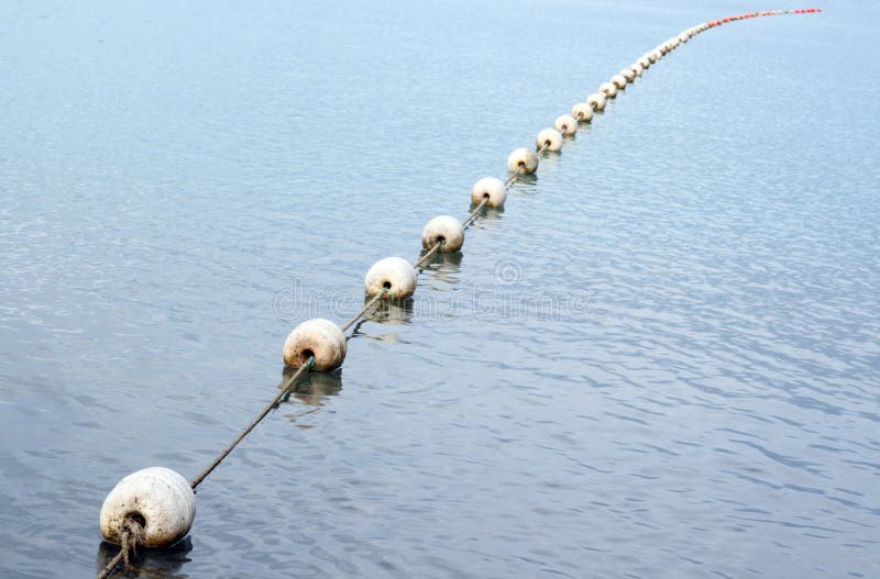 Booms on the sea surface stock photo. Image of rope, water - 20412524