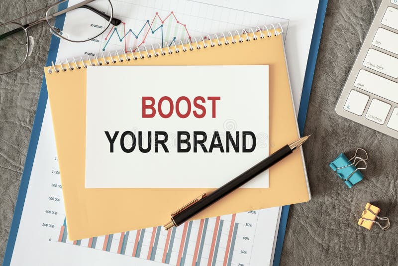 BOOST YOUR BRAND is Written in a Document on the Office Desk Stock ...