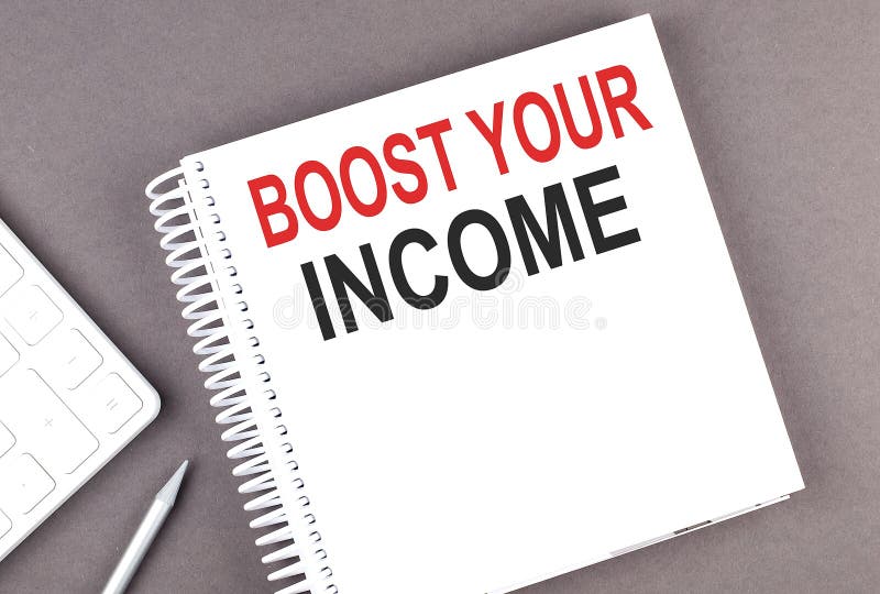 BOOST YOUR INCOME Text on the Notebook with Calculator and Pen Stock ...