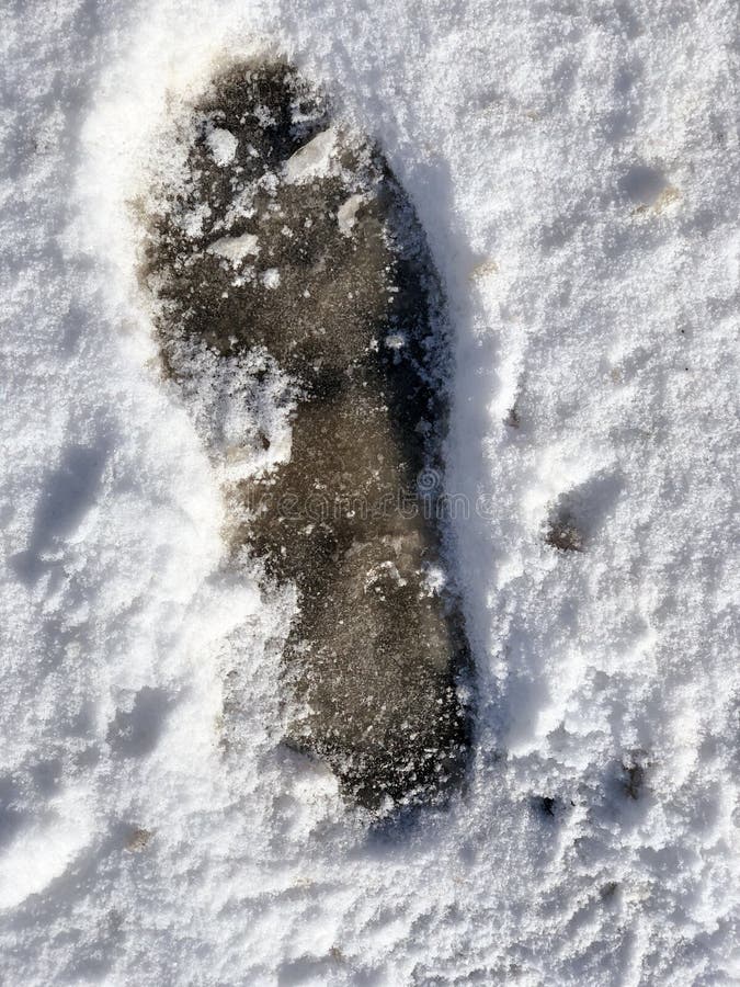 Boot footprint in the snow stock photo. Image of shore - 212933284