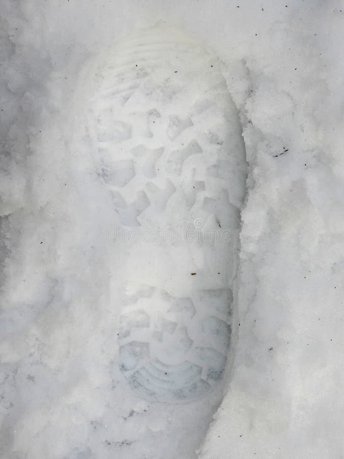 A Boot Tread Imprint Left in Winter Snow. Stock Image - Image of ...