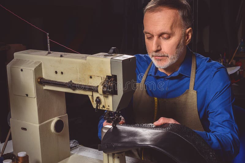 Bootmaker Working with a Pair of Shoes Stock Photo - Image of equipment ...