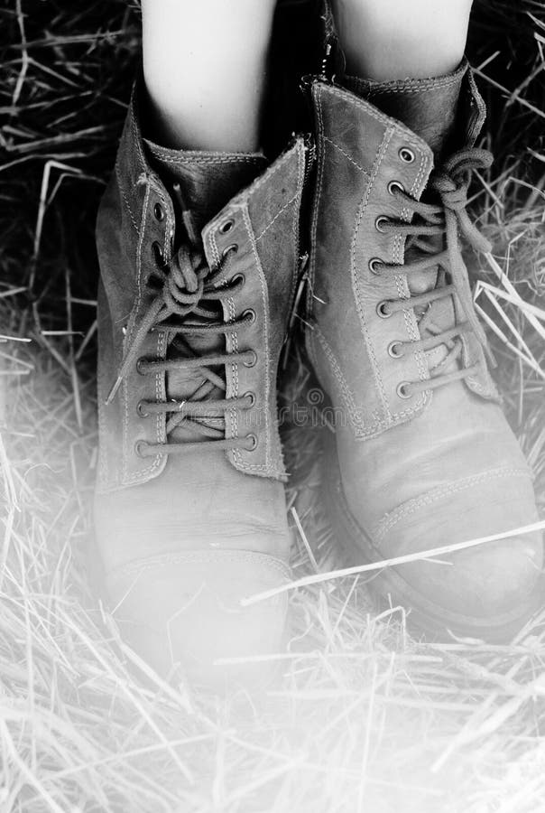 Vintage boots in straw stock photo. Image of pretty, boot - 23794384