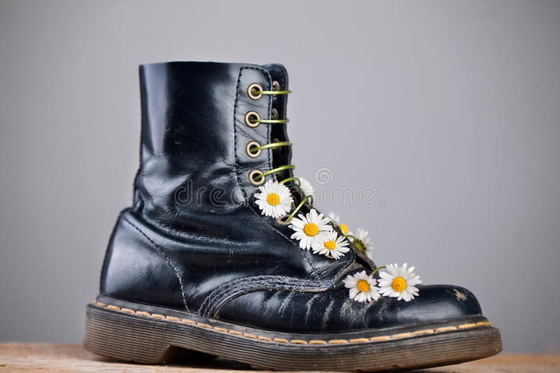 Boots with Daisy Flowers stock image. Image of black - 54985361