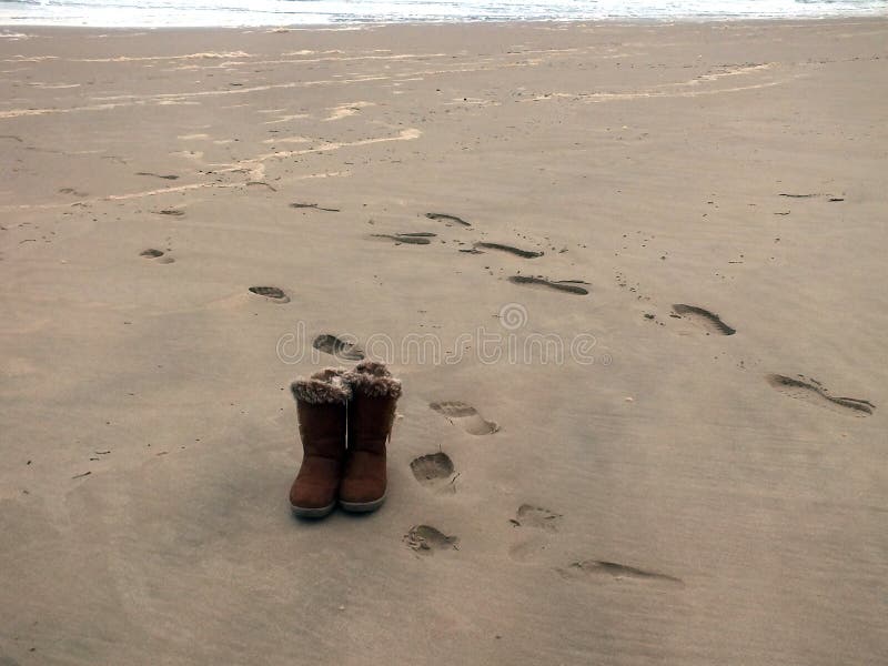 Footprints on beach sand stock photo. Image of oceans - 4856930