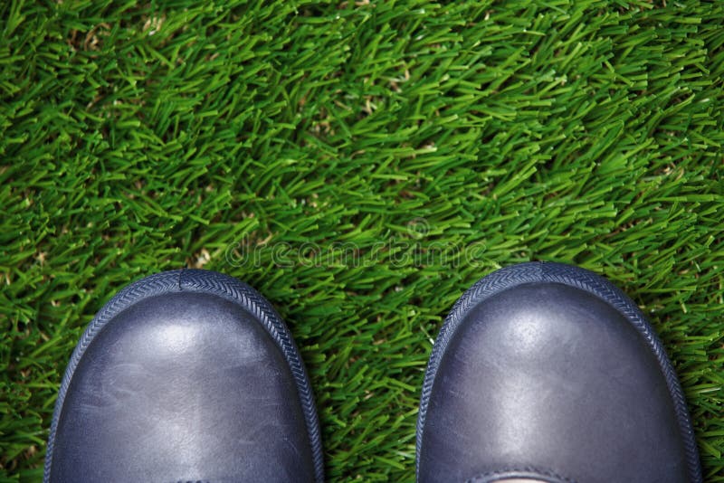 Boots on grass stock image. Image of lawn, horizontal - 100507779