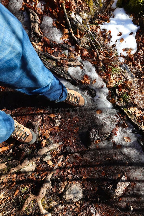 Boots and Legs with Jeans of the Adventurous Hiker on the Impervious ...