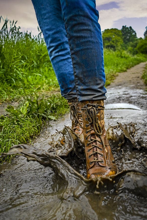 Boots is Walking in a Puddle Stock Image - Image of outdoor, adventure ...