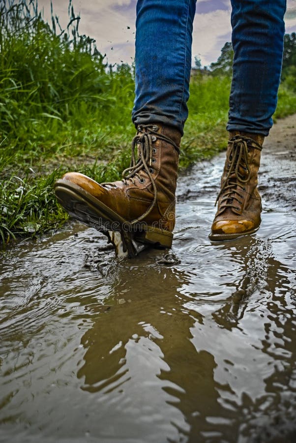 Boots is Walking in a Puddle Stock Image - Image of puddle, spring ...