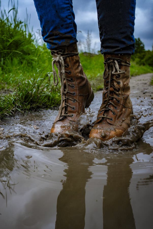 Boots is Walking in a Puddle Stock Image - Image of outdoor, adventure ...
