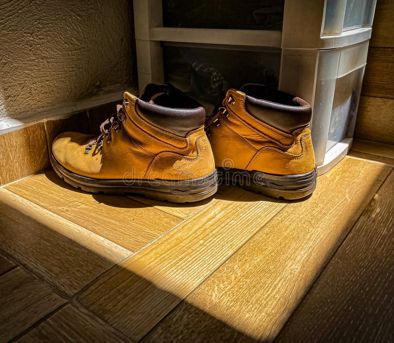 Boots on Wooden Floor, in a Sunshine Square. Stock Photo - Image of ...