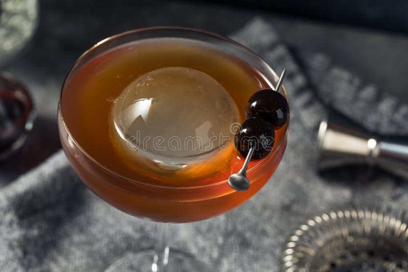 Boozy Cold Manhattan Cocktail with a Big Ice Cube Stock Photo - Image ...