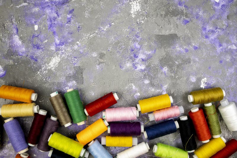 Border of Spools of Bright Threads on an Abstract Background, Flat Lay ...