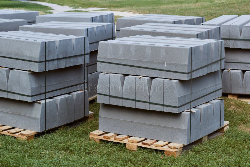 Border. Stacked Borders on Pellets and Lying on the Grass. Pallets with ...