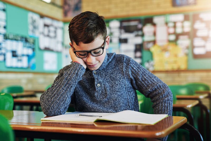Bored, Book and Student in Classroom at Elementary School in Lesson for ...