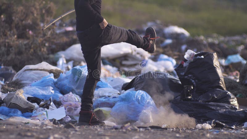 Bored Boy Making Dust in Dump Stock Image - Image of crouching, male ...