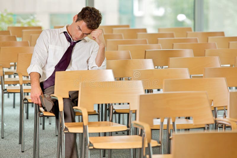 Bored Businessman Sitting at Conference Room Stock Photo - Image of ...
