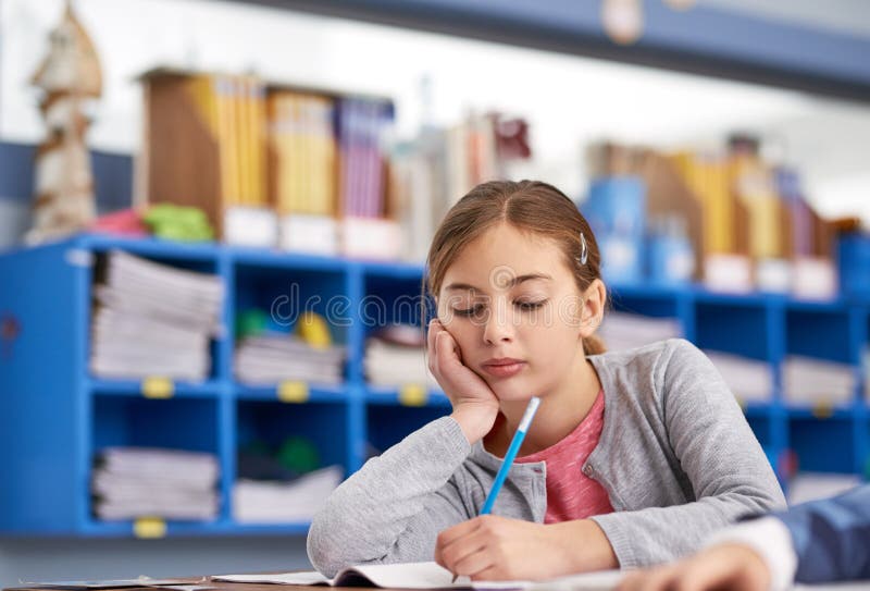 Bored, Education and Writing with Girl Student in Classroom of School ...