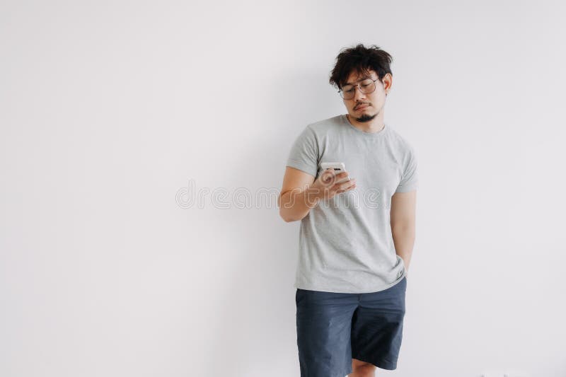 Bored Face Man Using Mobile Phone App Boringly Isolated on White. Stock ...