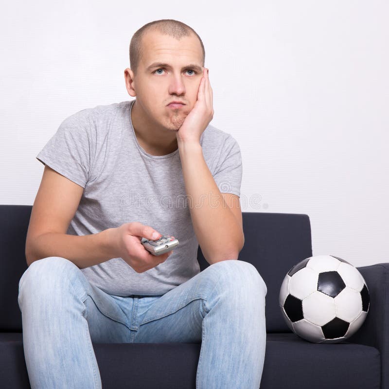 Bored Fan with Ball Watching Soccer Game on Tv Stock Image - Image of ...