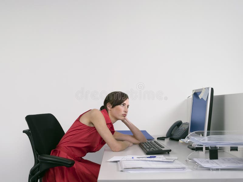 Bored Female Office Worker at Desk Stock Image - Image of executive ...
