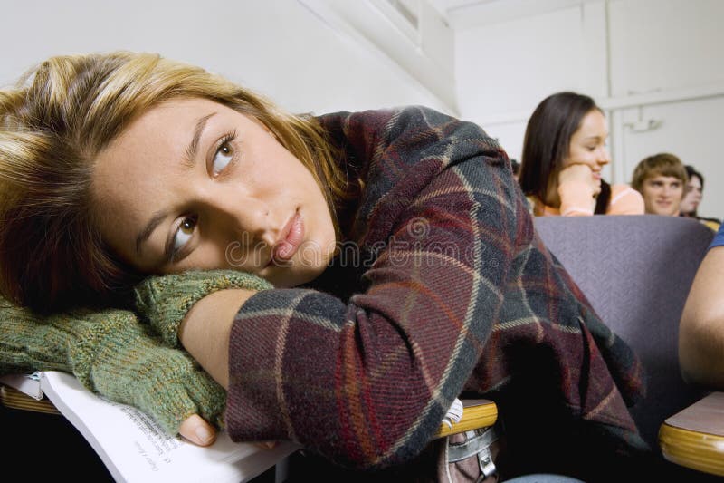 Bored Female Student in Classroom Stock Photo - Image of student, chin ...