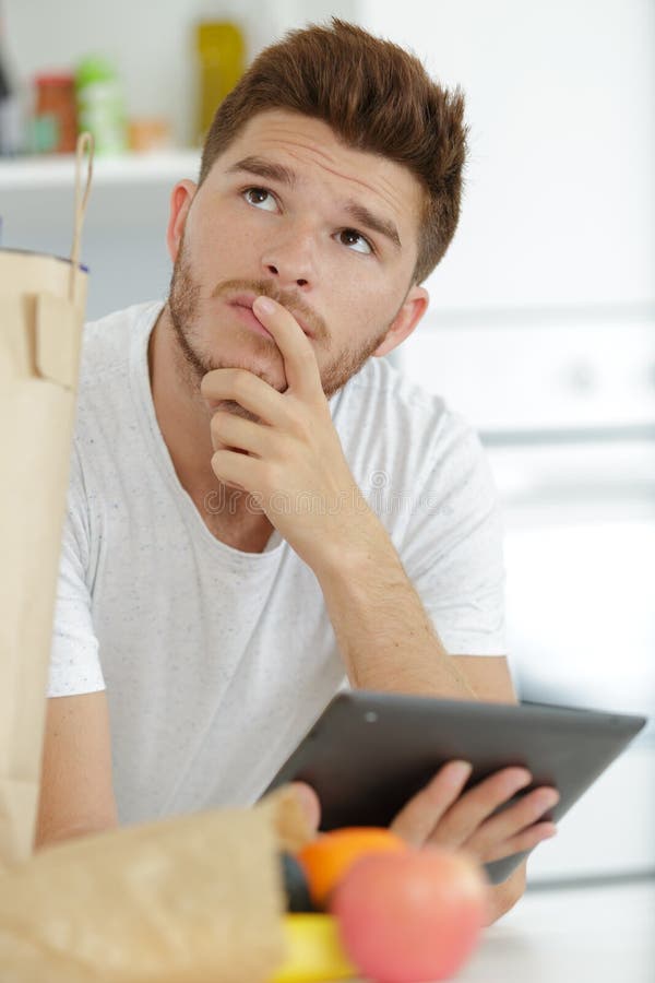 Bored Hipster Man Using Tablet Computer Stock Image - Image of hipster ...
