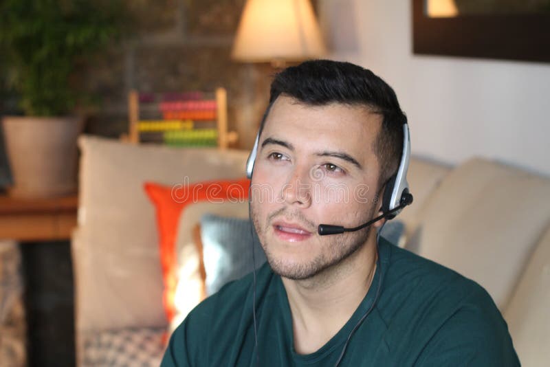 Bored Looking Man Using Headset Stock Photo - Image of asian ...