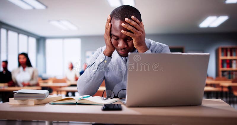 Bored Man in Classroom Using Computer Technology Stock Photo - Image of ... Bored Man in Classroom Using Computer Technology Stock Photo - Image of ...