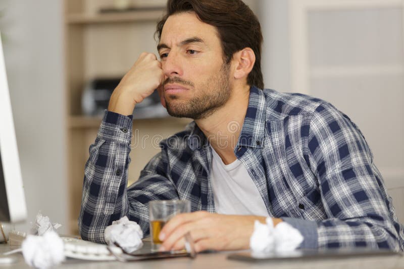 Bored Man with Drink Sat in Front Computer Stock Image - Image of ...