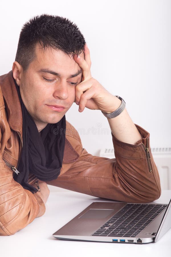 Bored man with laptop stock image. Image of pain, hand - 61338143