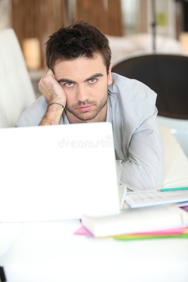 Bored man using laptop stock image. Image of bored, executive - 22486021