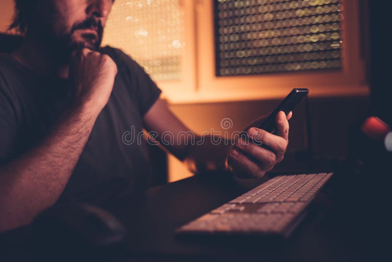 Bored Man Wasting Time Using Mobile Phone Stock Image - Image of ...