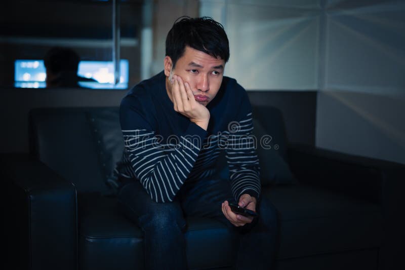 Bored Man Watching TV on Sofa at Night Stock Photo - Image of bored, boring: 338764180