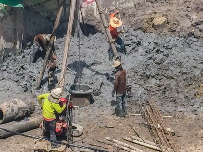 Bored Piling Workers are Drilling Mud Hole with Tripod Rig and S Stock ...
