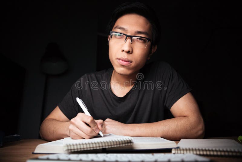 Bored Serious Man in Glasses Learning and Writing Stock Image - Image ...