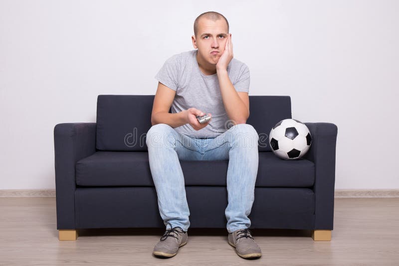 Bored Soccer Fan with Ball Watching Game on Tv Stock Image - Image of ...