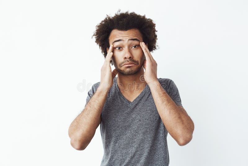 Bored Tired African Man Touching Face with Hands Over White Background ...