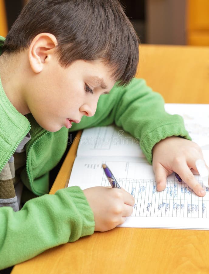 Boy doing school homework stock photo. Image of exercise - 34026696