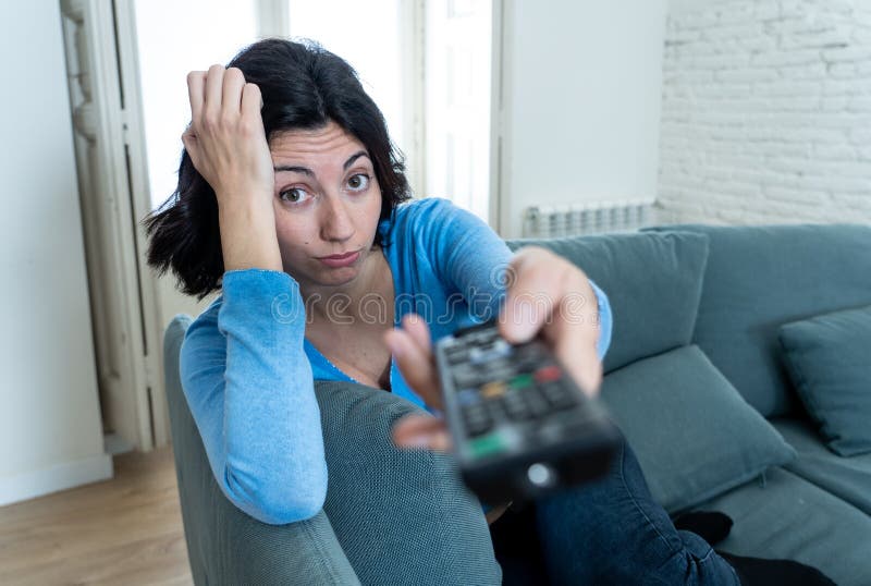 Bored Woman Changing TV Channels with Remote Control Stock Photo - Image of habit ...