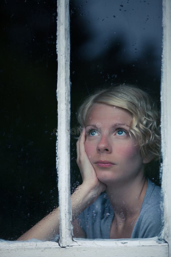 Bored Woman Looking at the Rainy Weather by the Window Stock Image ...