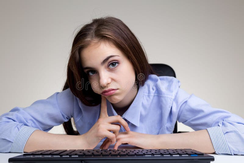 Bored woman using keyboard stock image. Image of device - 72417249