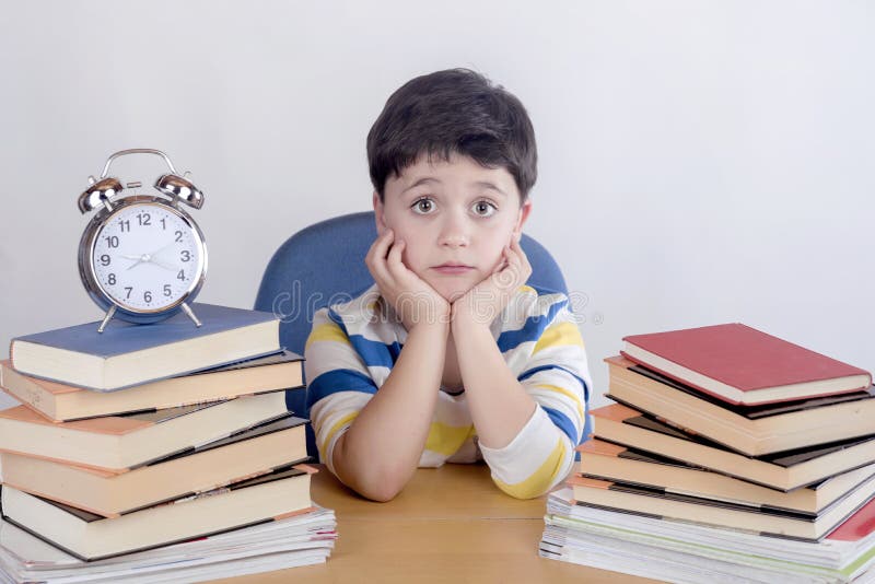 Boring schoolboy studying stock photo. Image of burden - 99824518